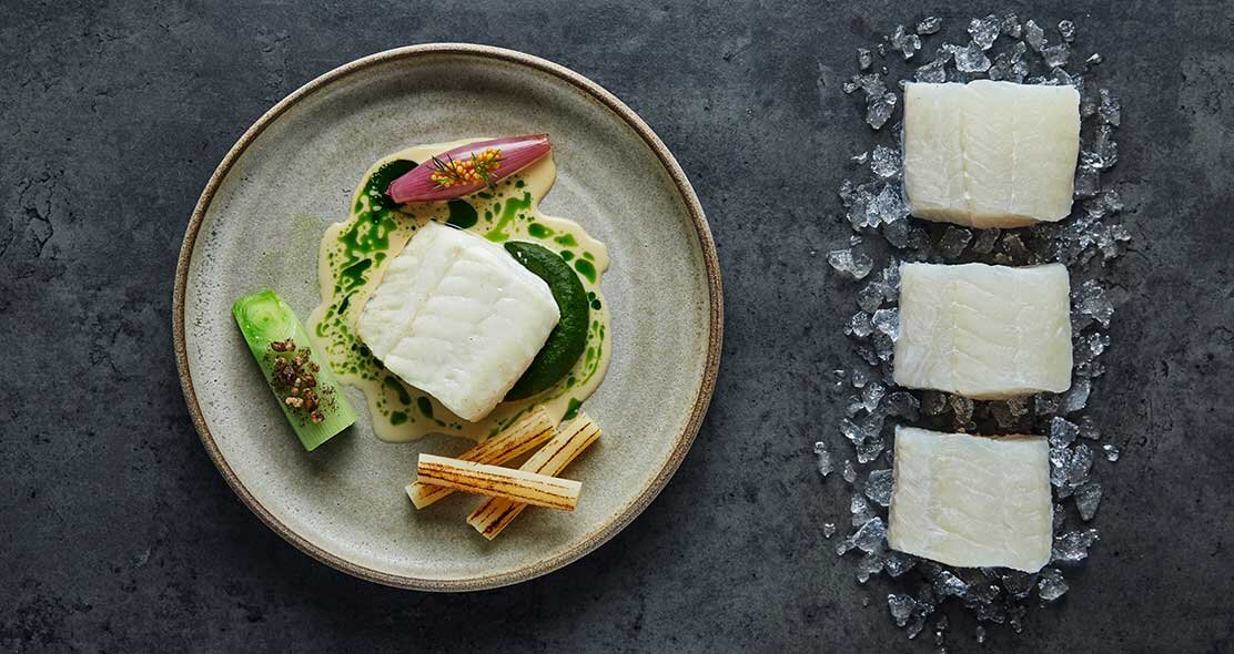 Baked Norwegian cod with vegetables and a creamy blue mussel sauce ...